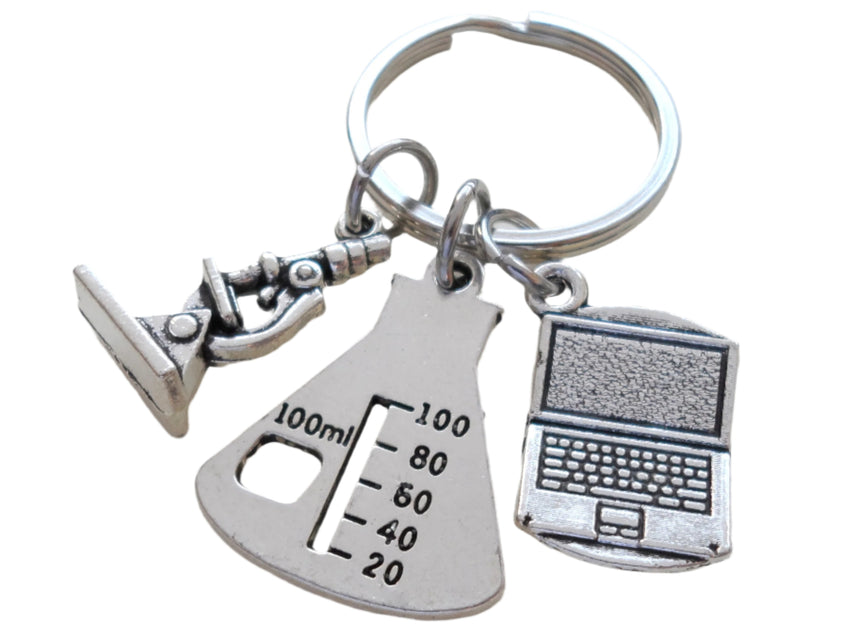A science lab themed keychain with a microscope, a laboratory flask ...